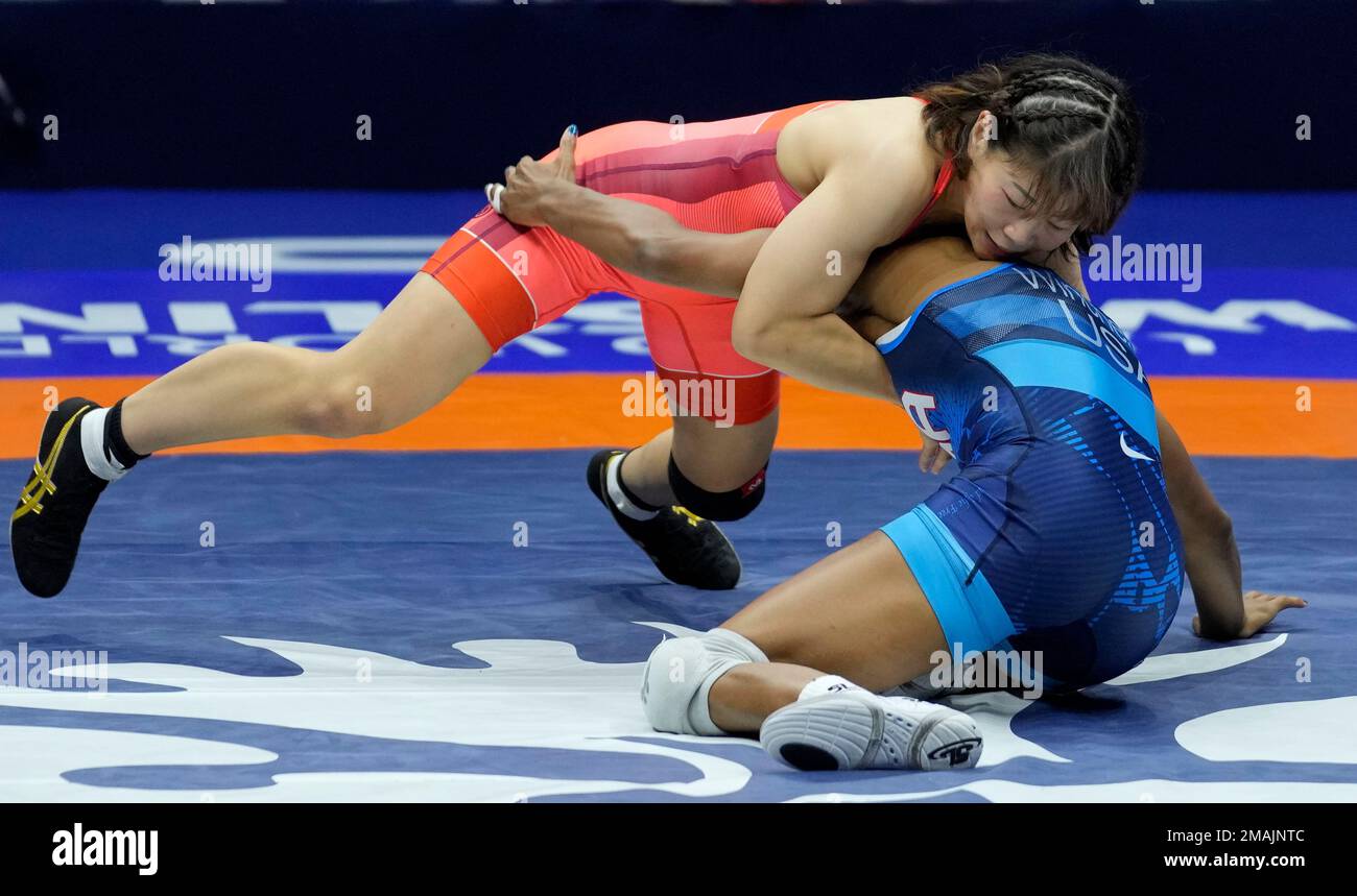 Japan's Mayu Shidochi Mukaida, left, and Jacarra Gwenisha Winchester of USA compete in their ...