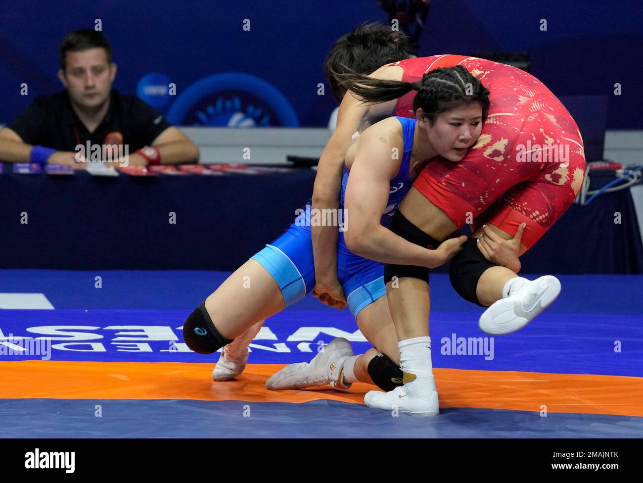 Kyrgyzstan's Aisuluu Tynybekova, right, and Japan's Nonoka Ozaki ...
