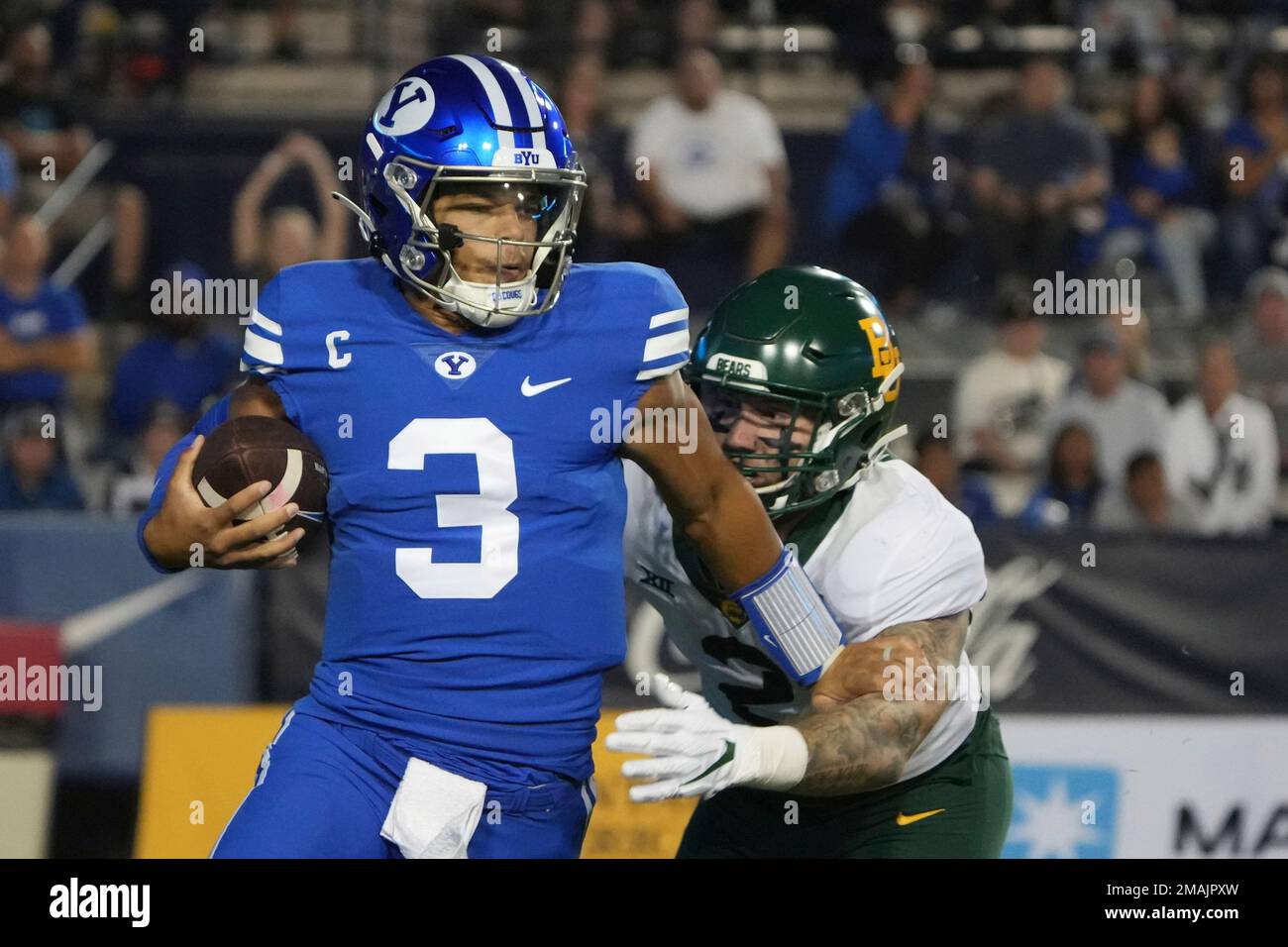 BYU quarterback Jaren Hall (3) runs away from Baylor linebacker Matt ...