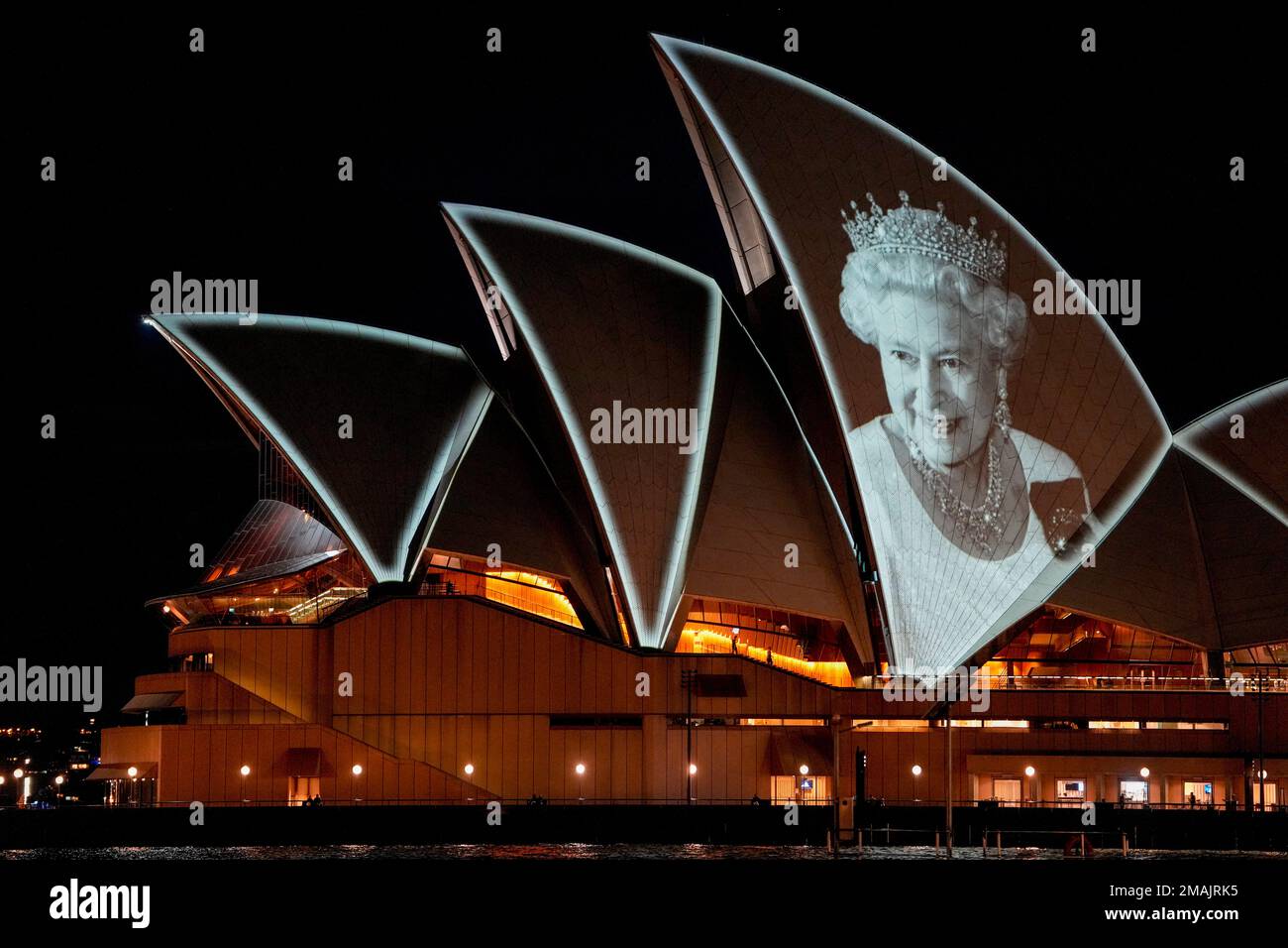 The Sydney Opera House is illuminated with a portrait of Queen ...