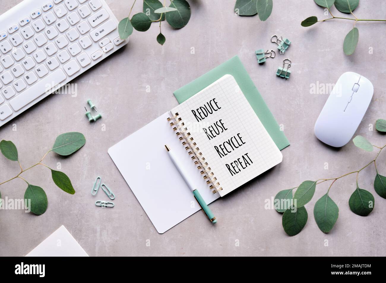 Text Reduce, reuse, recycle, repeat written in notebook. Eucalyptus ...