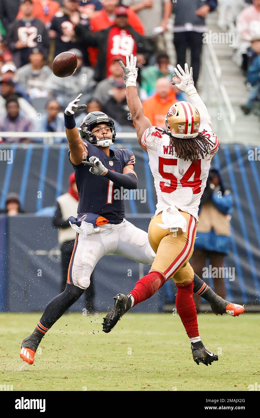 Chicago Bears quarterback Justin Fields, left, passes the ball against ...