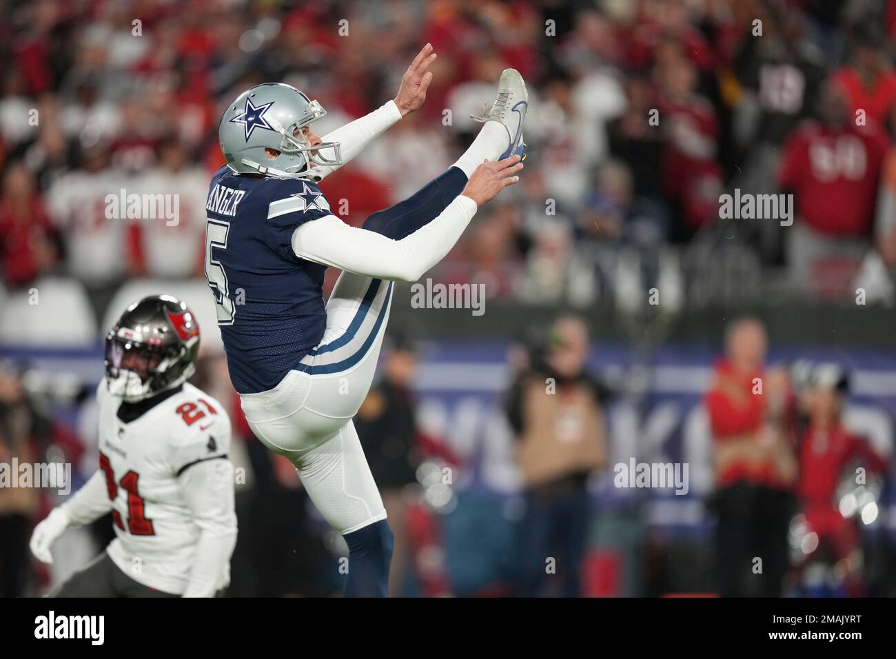 Dallas Cowboys punter Bryan Anger (5) watches his punt during an NFL ...