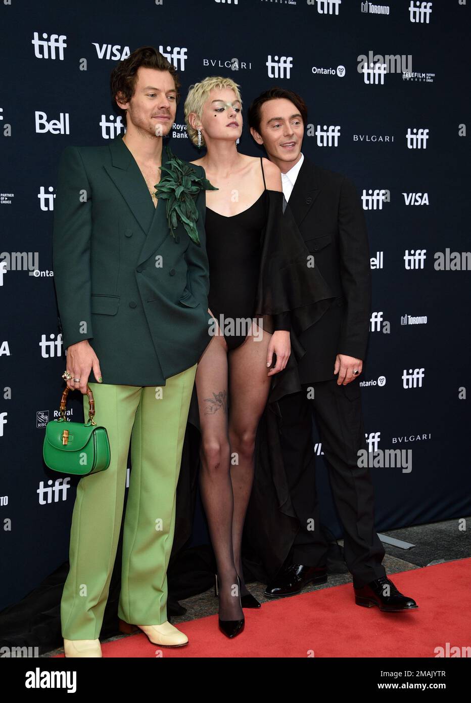 Harry Styles, from left, Emma Corrin, and David Dawson attend the ...