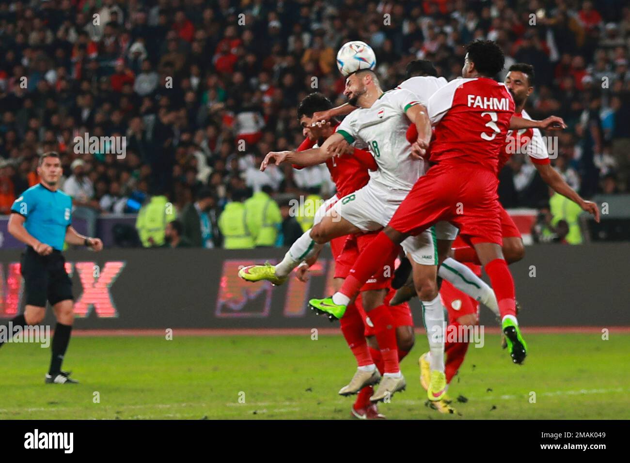 Iraq's Ayman Hussein, center, fights for the ball, during the Arabian ...