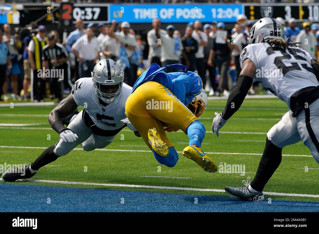 Los Angeles Chargers wide receiver DeAndre Carter, middle, catches a ...