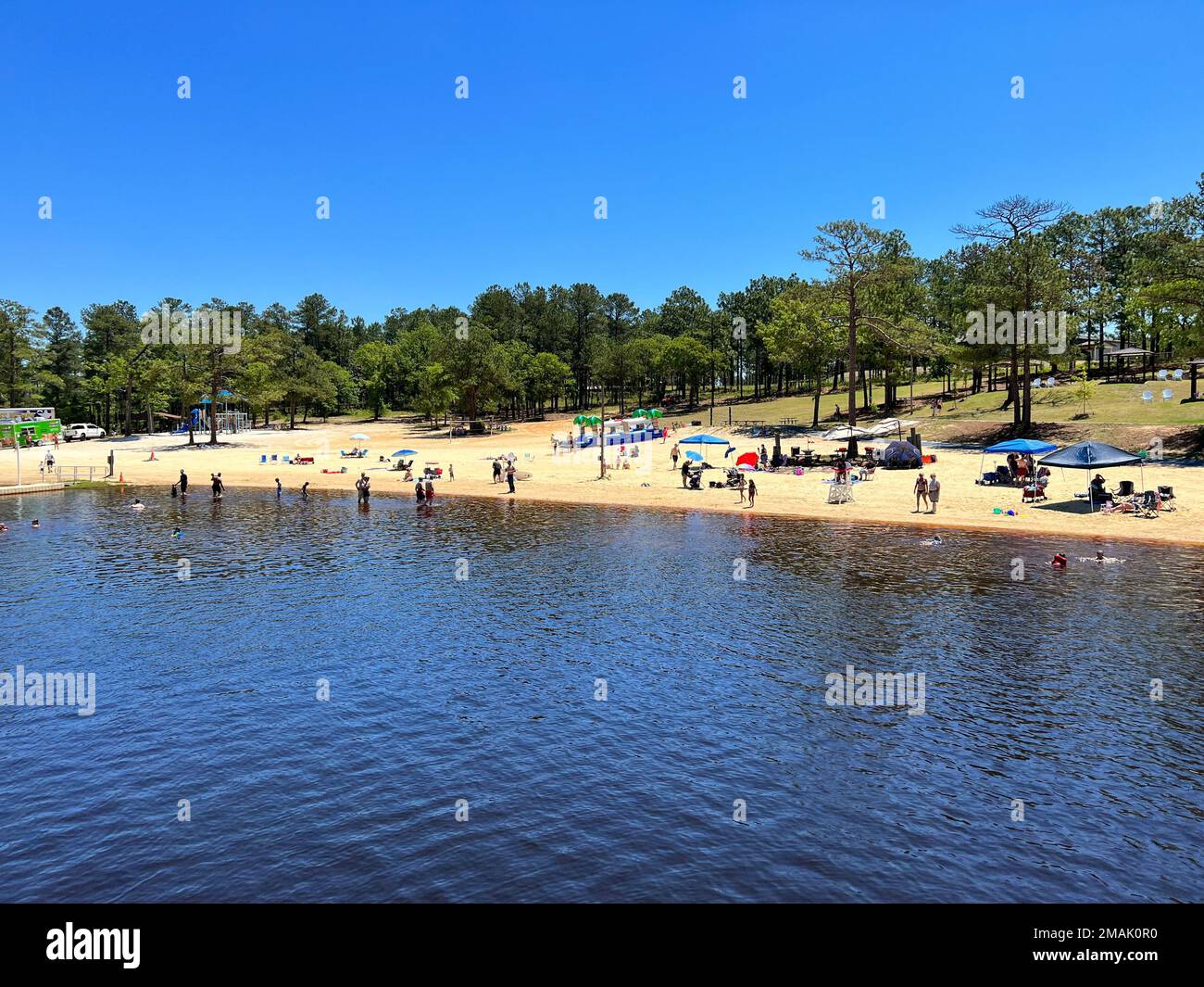 Beachgoers enjoy the lake on May 28 at Smith Lake Beach. The beach ...