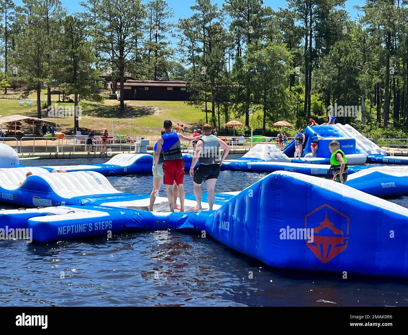 Beachgoers make a plan of attack for the obstacles on the brand new ...