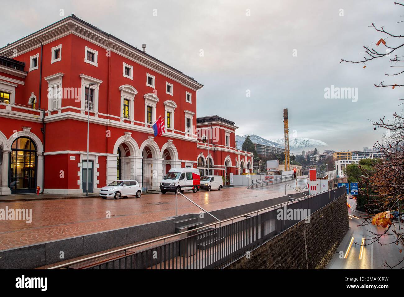 Awe A hazy view of the Locarno train station and the Swiss Alps in the ...