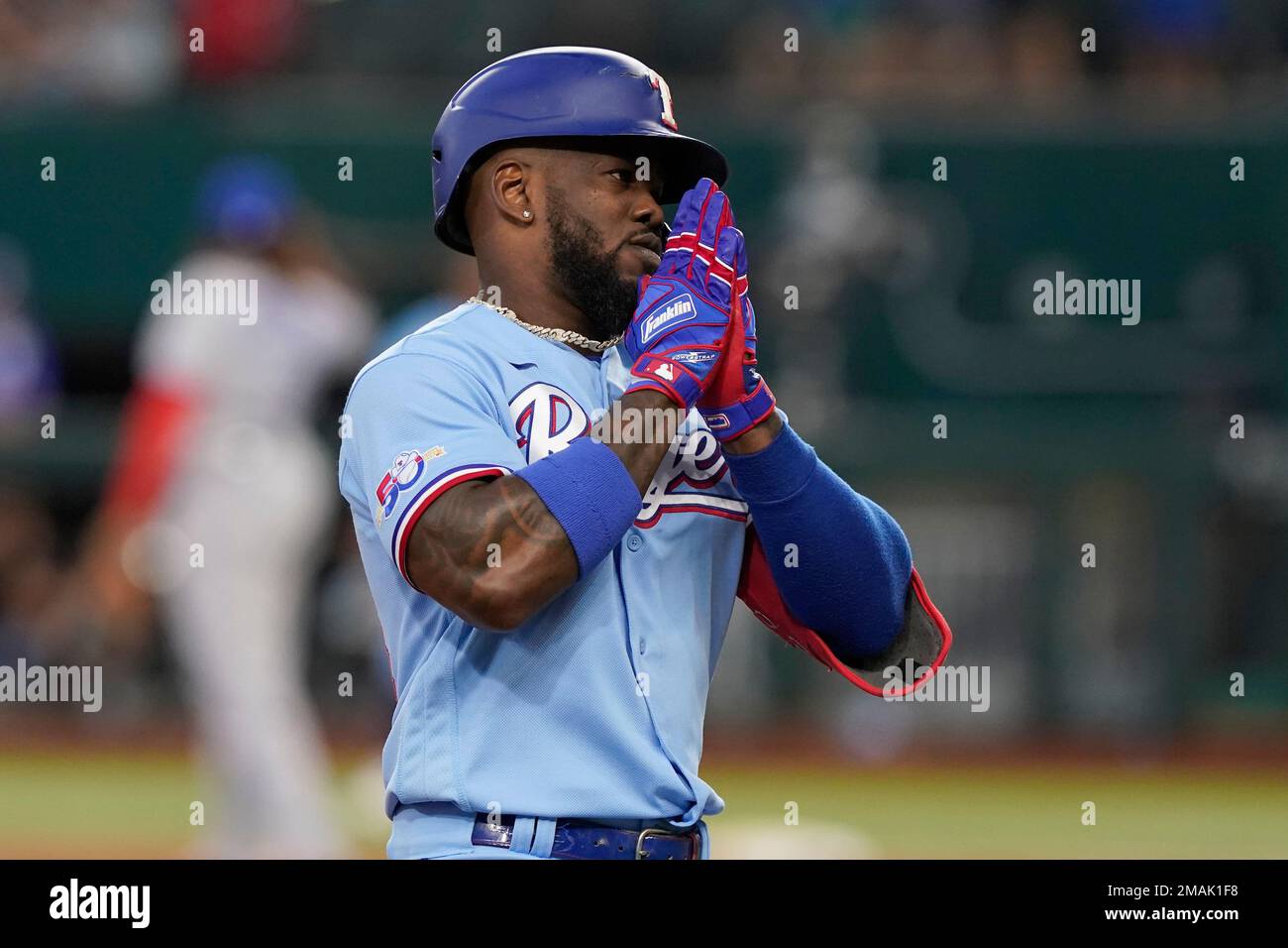 Texas Rangers' Adolis Garcia gestures as he rounds the bases after ...