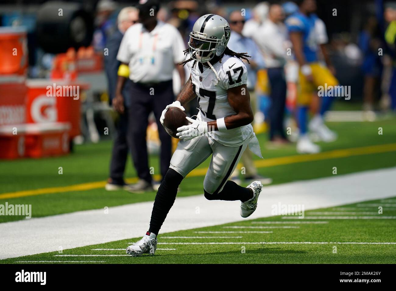 Las Vegas Raiders wide receiver Davante Adams (17) warms up before an ...