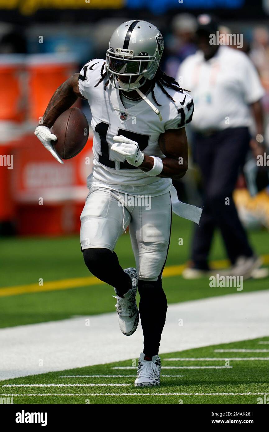 Las Vegas Raiders wide receiver Davante Adams (17) warms up before an ...