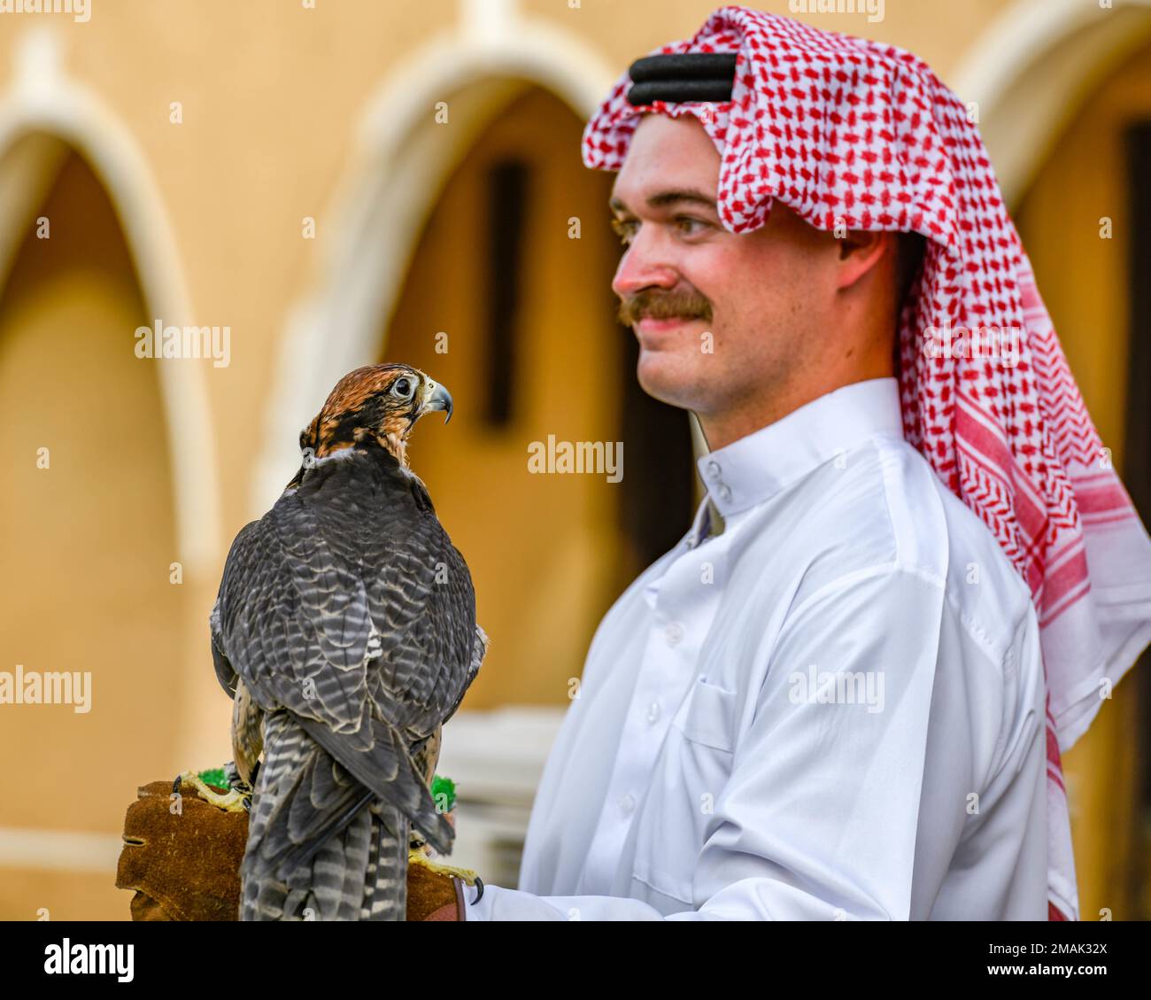 A U.S. service member holds a falcon at the Prince Sultan Air Base ...