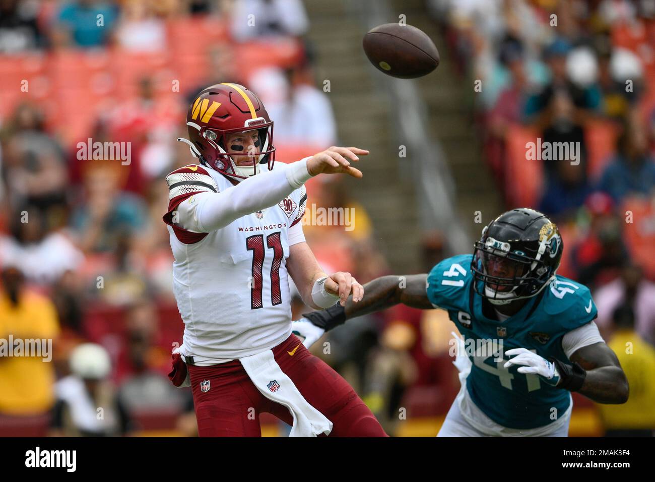 Washington Commanders quarterback Carson Wentz (11) throws the ball ...