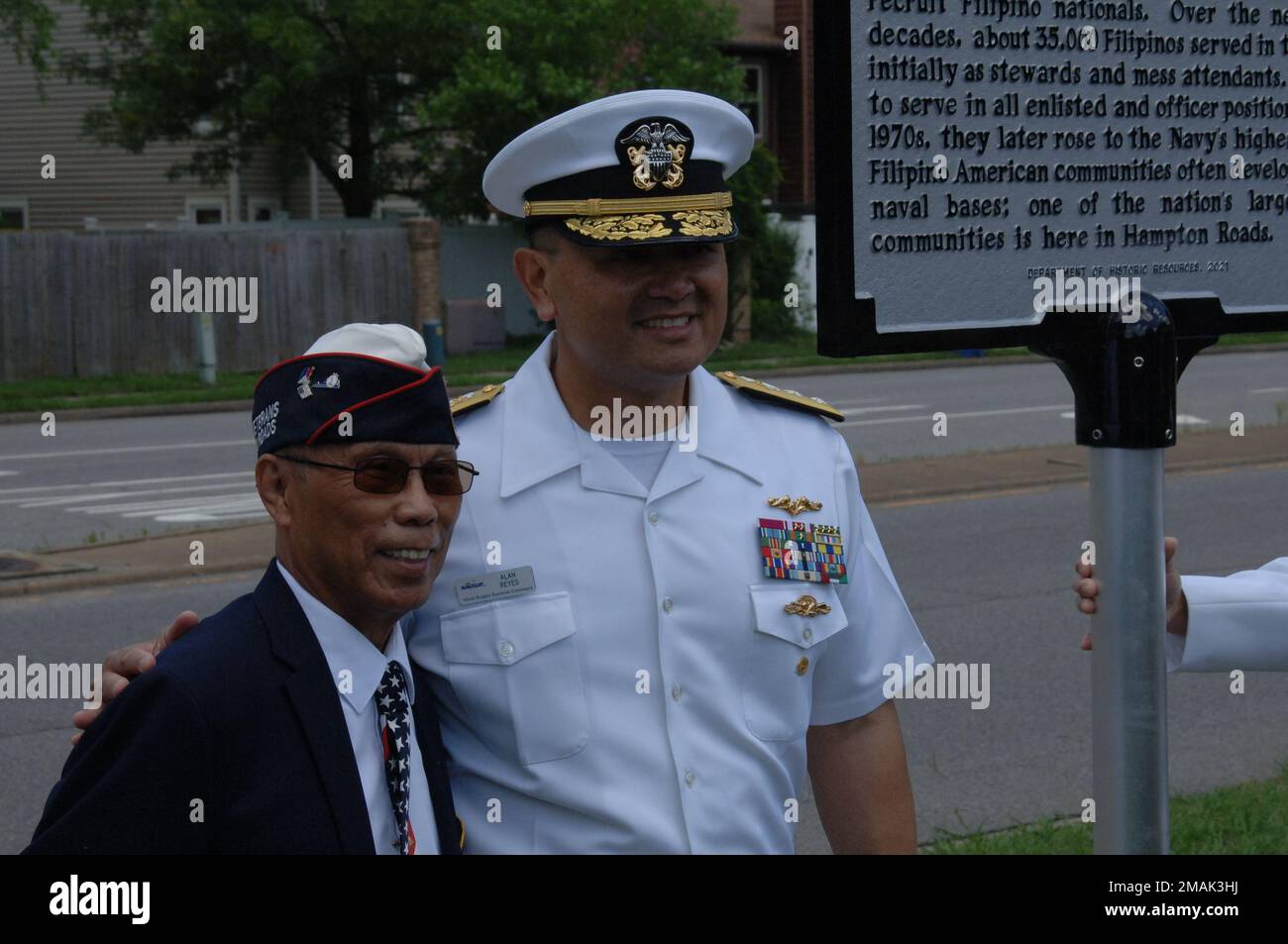 RADM Alan Reyes, Deputy Commander, Naval Supply Systems Command, stops ...