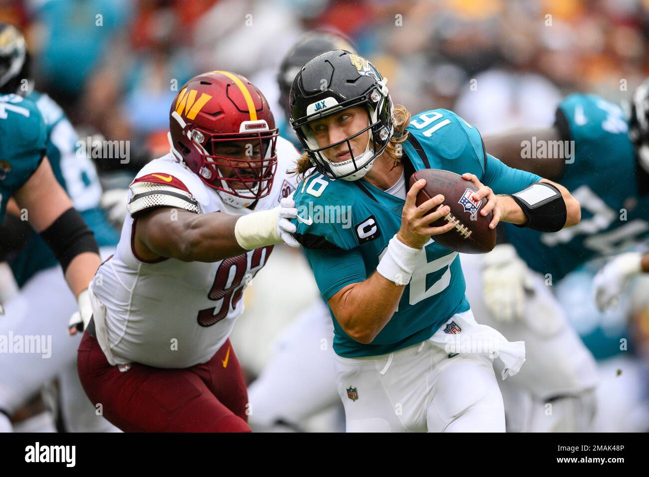 Washington Commanders defensive tackle Jonathan Allen (93) reaches out ...