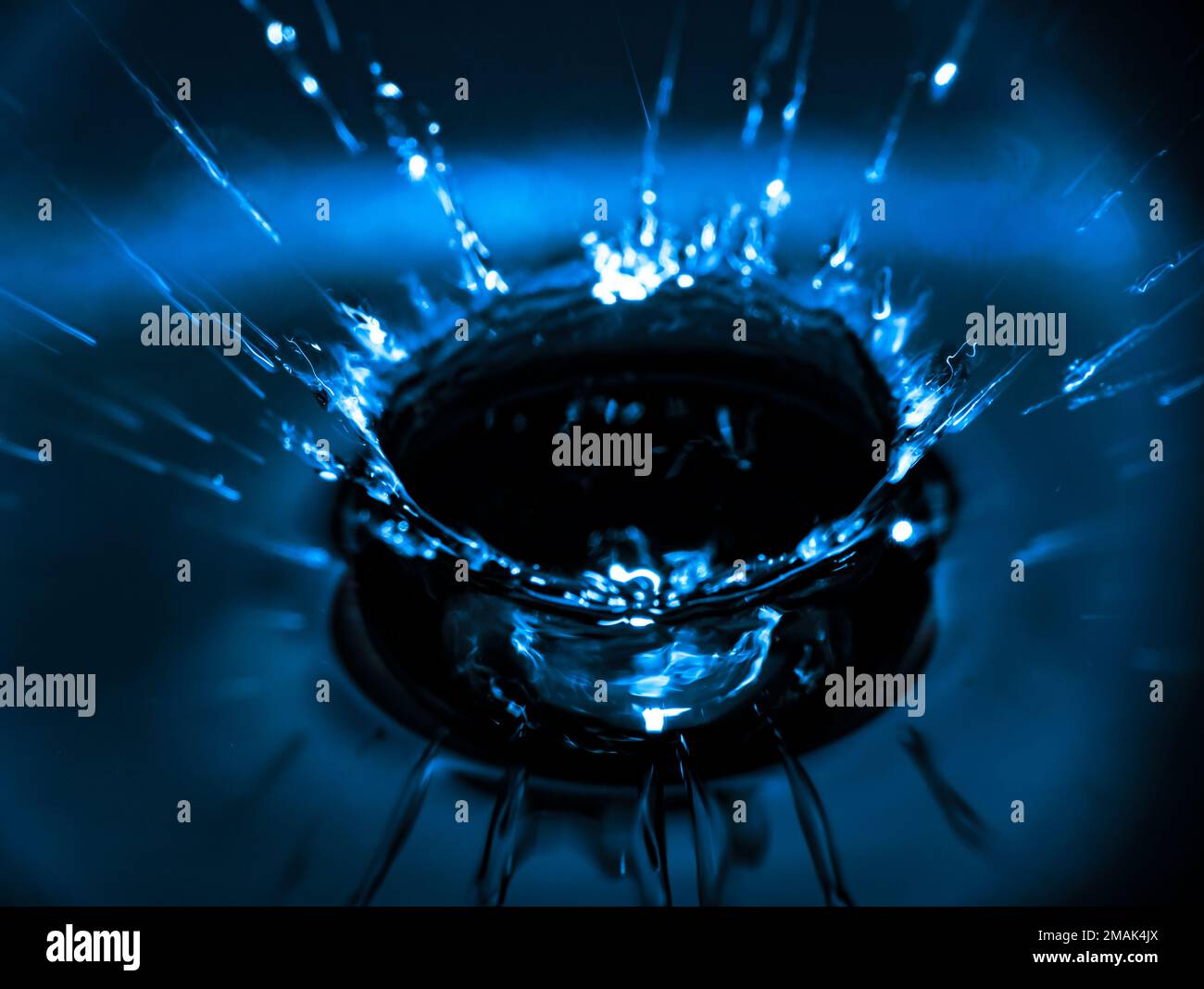 Macro photo of unique shapes formed by splashing water drop Stock Photo ...
