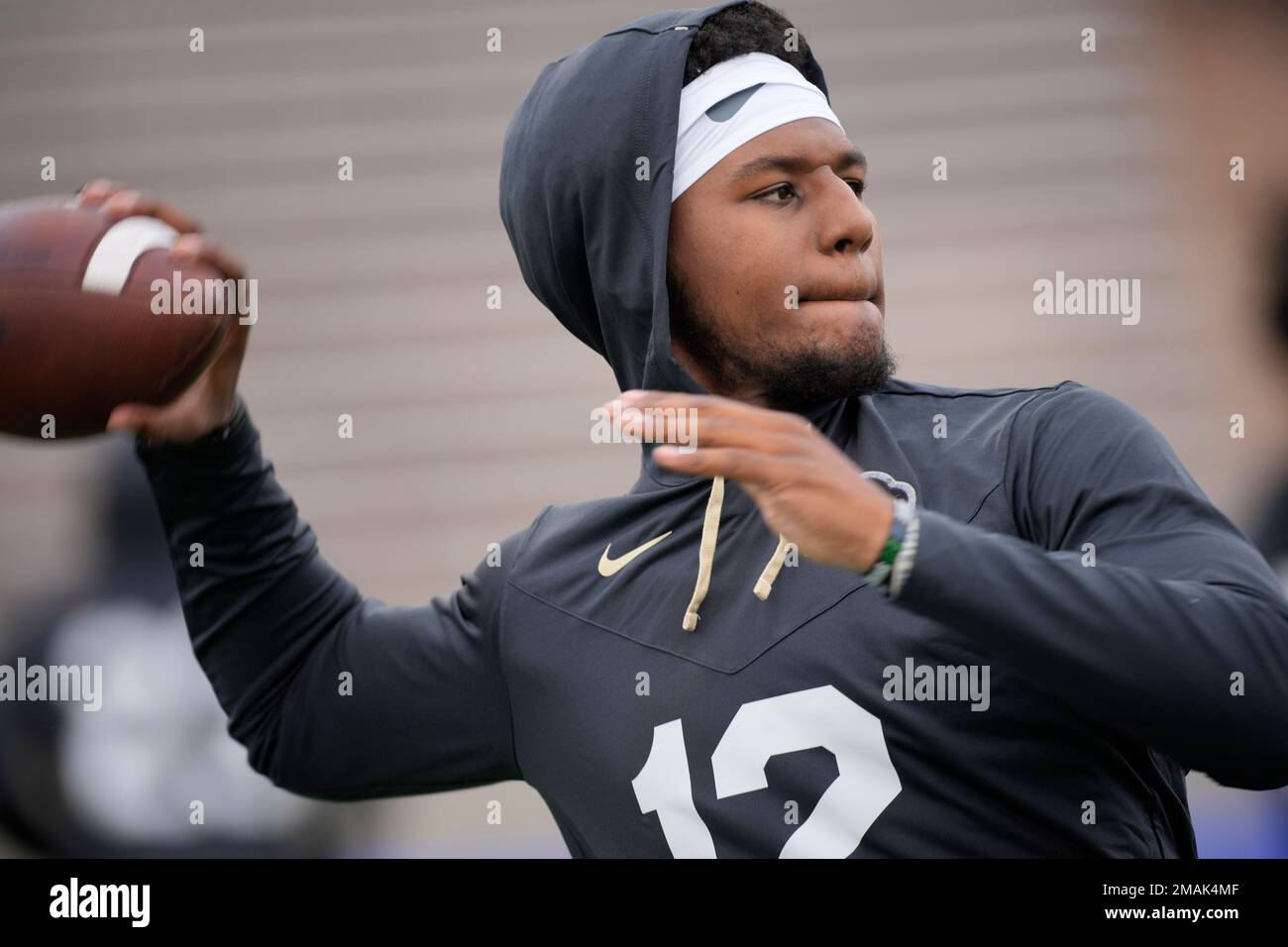 Colorado quarterback Brendon Lewis (12) warms up before an NCAA college ...