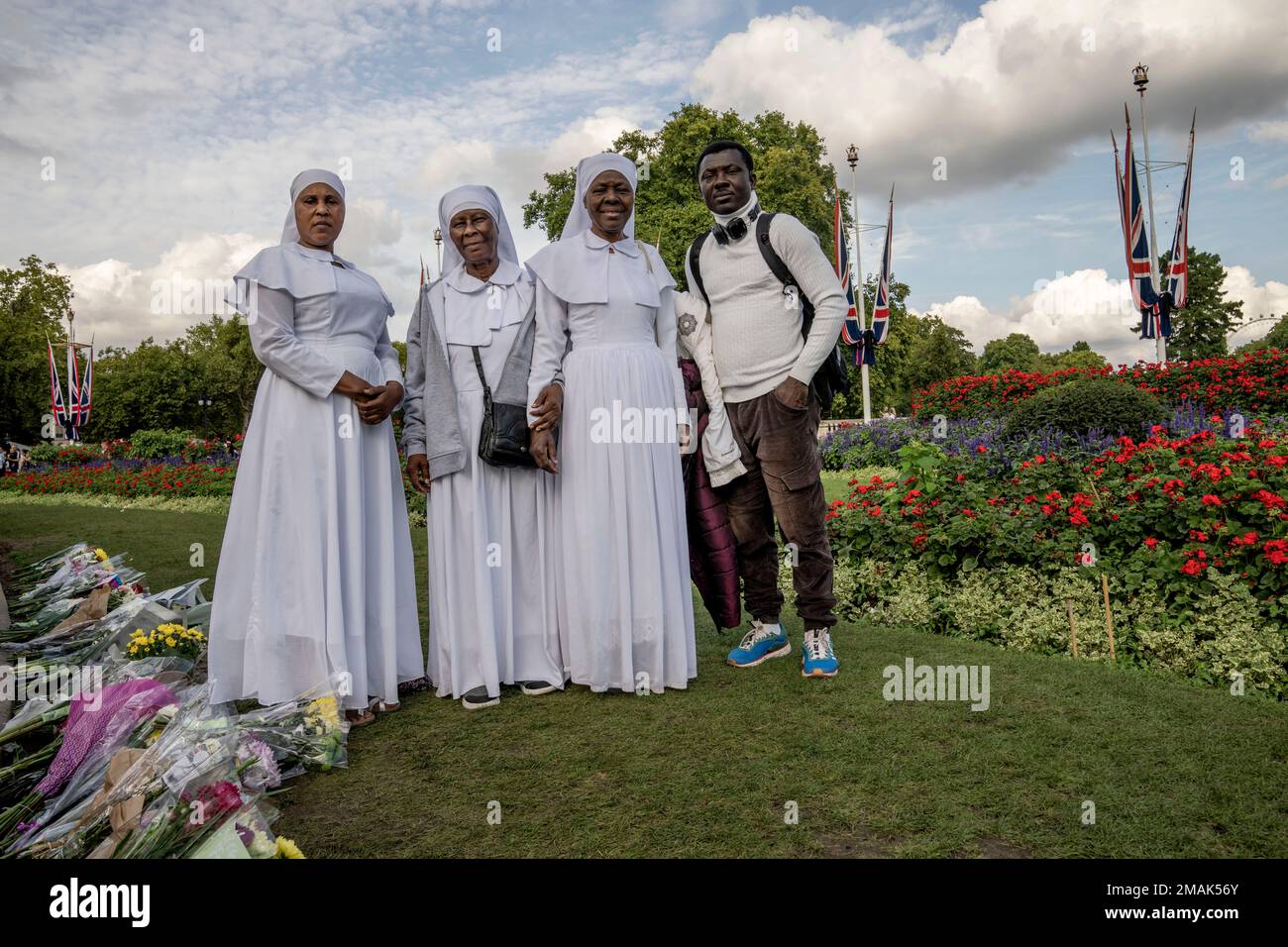 Nigerian nuns poses for a photograph after laying flowers for Queen ...