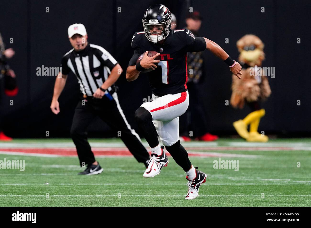 Atlanta Falcons quarterback Marcus Mariota (1) runs in the open field ...