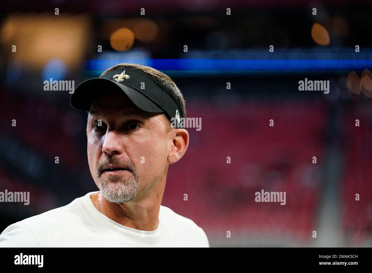 New Orleans Saints head coach Dennis Allen walks the turf before the ...