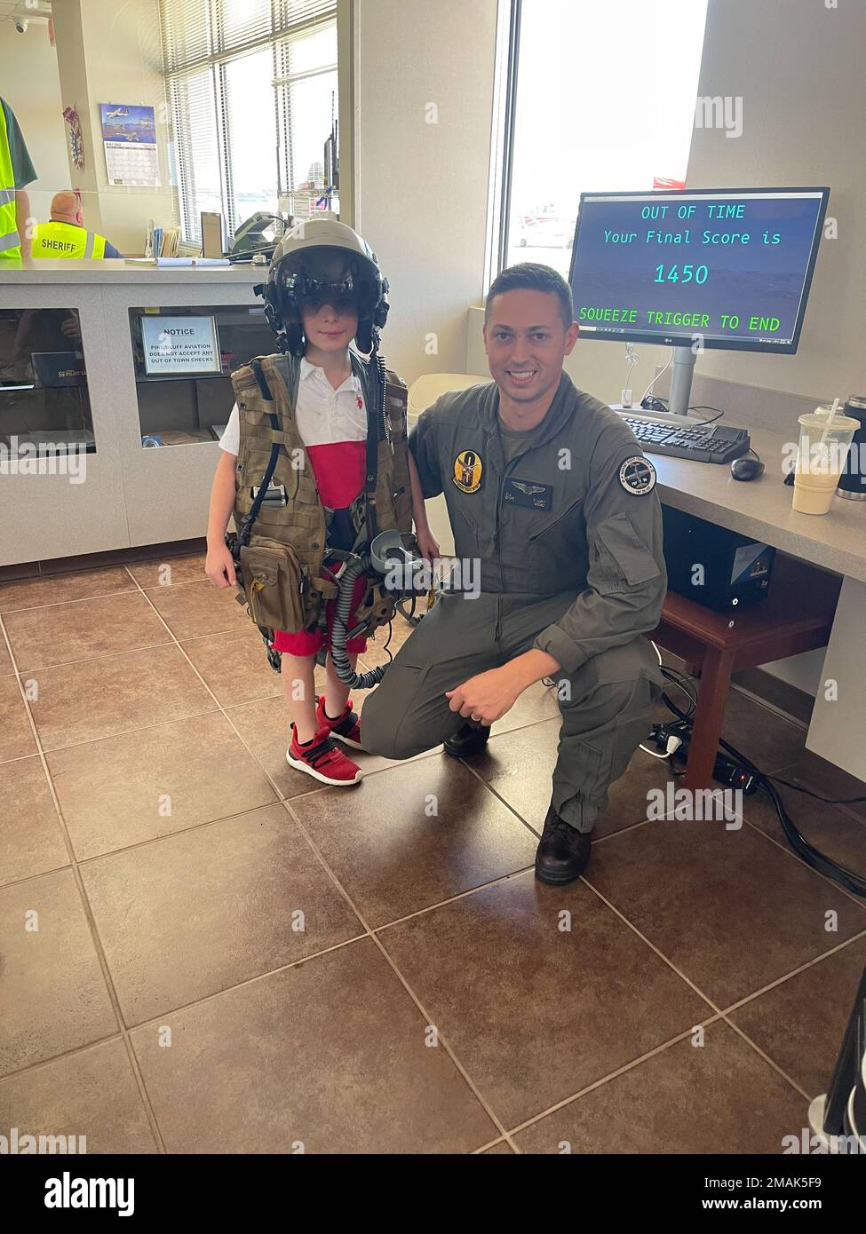 Capt. Knapp poses with a future aviator following his operation of the ...