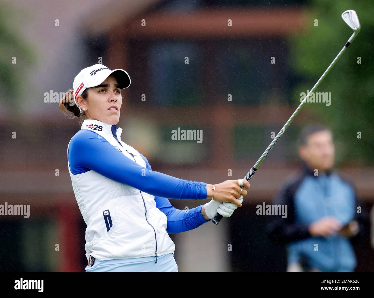 Maria Fassi, of Mexico, watches her approach shot on the fifth hole ...