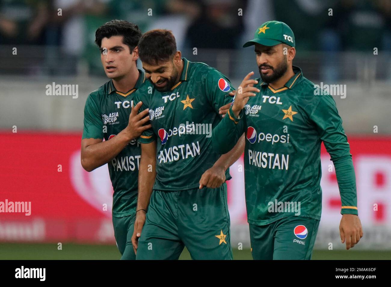 Pakistan's Haris Rauf, center, celebrates with teammates Naseem Shah ...