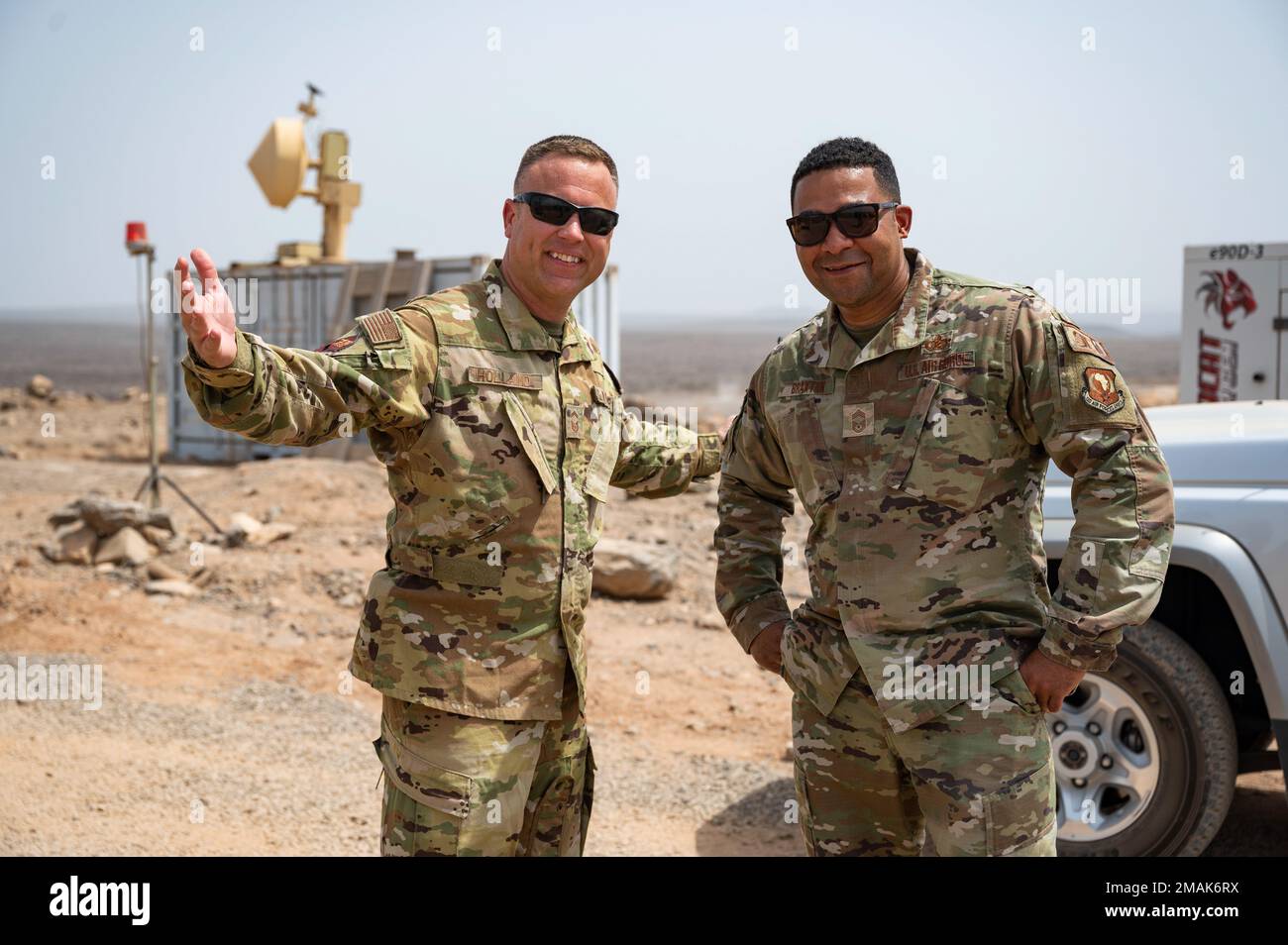 U.S. Air Force Senior Master Sgt. Blaine Holland, left, 776th ...