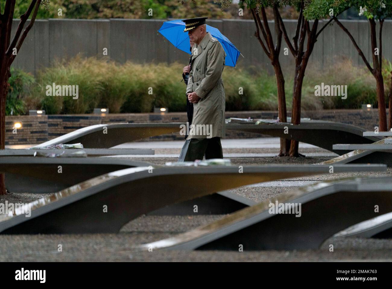Visitors walk through the National 9/11 Pentagon Memorial outside the ...