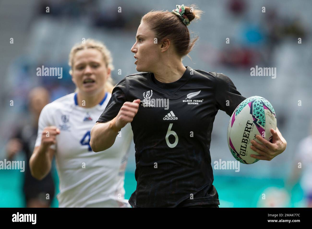 Michaela Blyde of New Zealand races away from Lou Noel of France during ...
