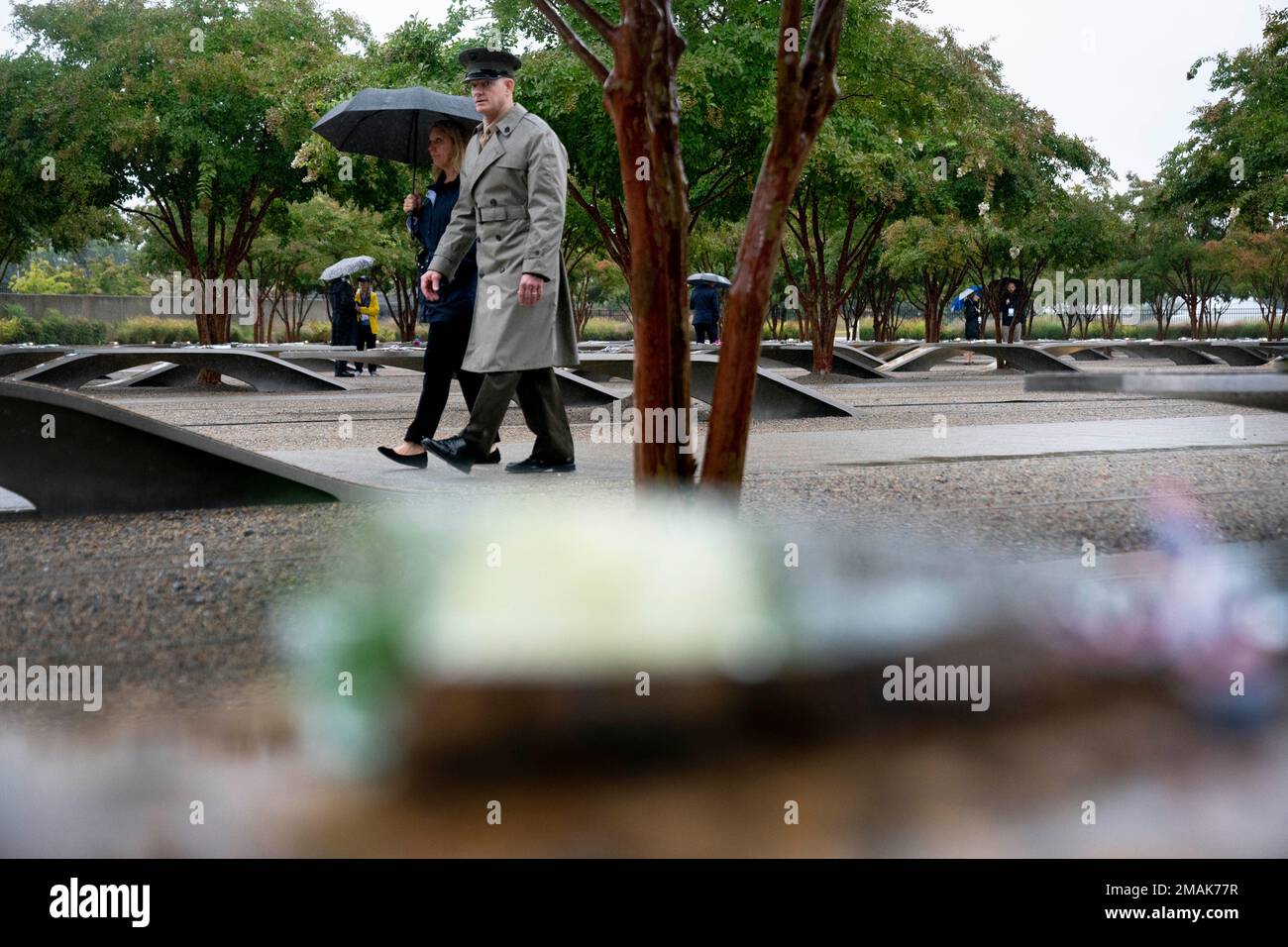 Visitors walk through the National 9/11 Pentagon Memorial outside the ...