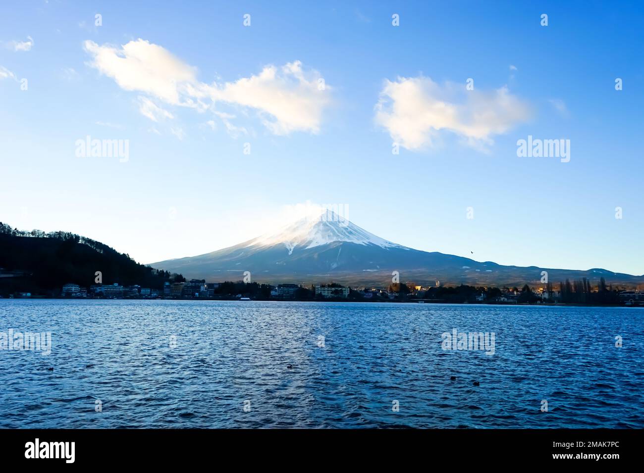 A beautiful view of the Mount Fuji from Lake Kawaguchiko under a blue ...