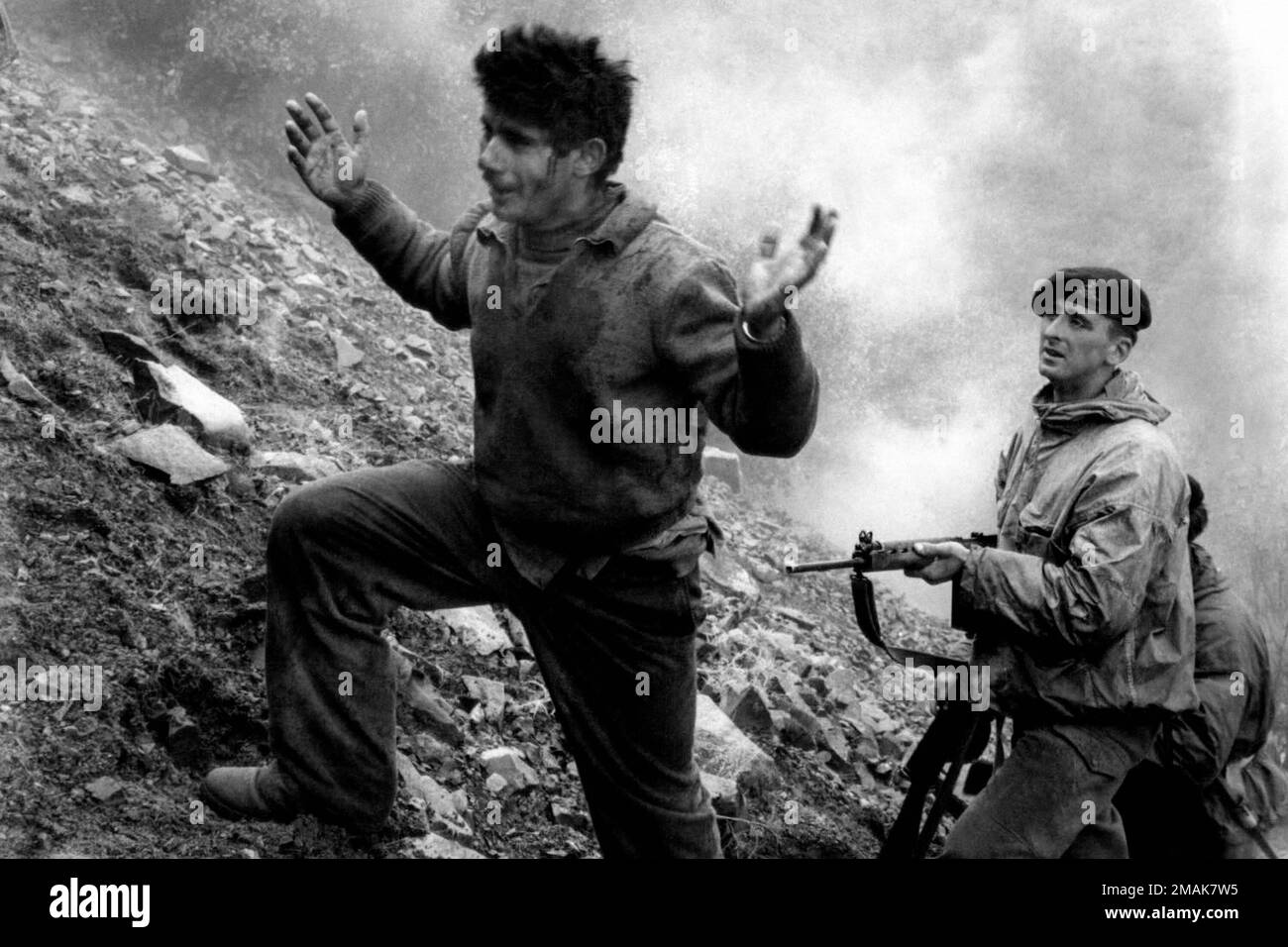 With hands raised, Agustinds Efstathios, 22, climbs the mountainside ...