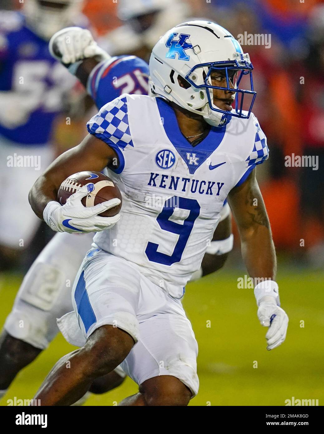 Kentucky wide receiver Tayvion Robinson (9) runs past Florida defensive ...