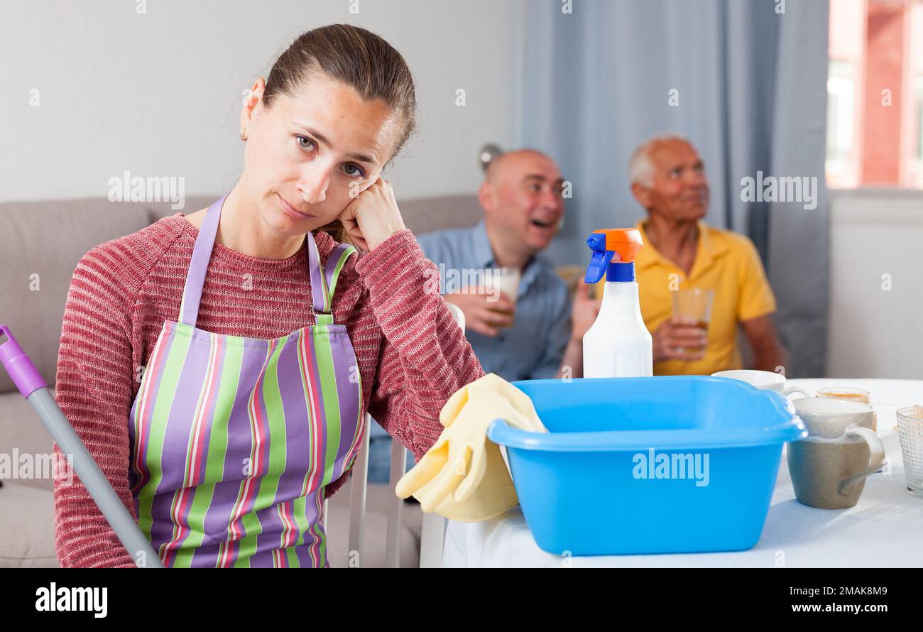 Woman cleaning man watching hi-res stock photography and images - Alamy