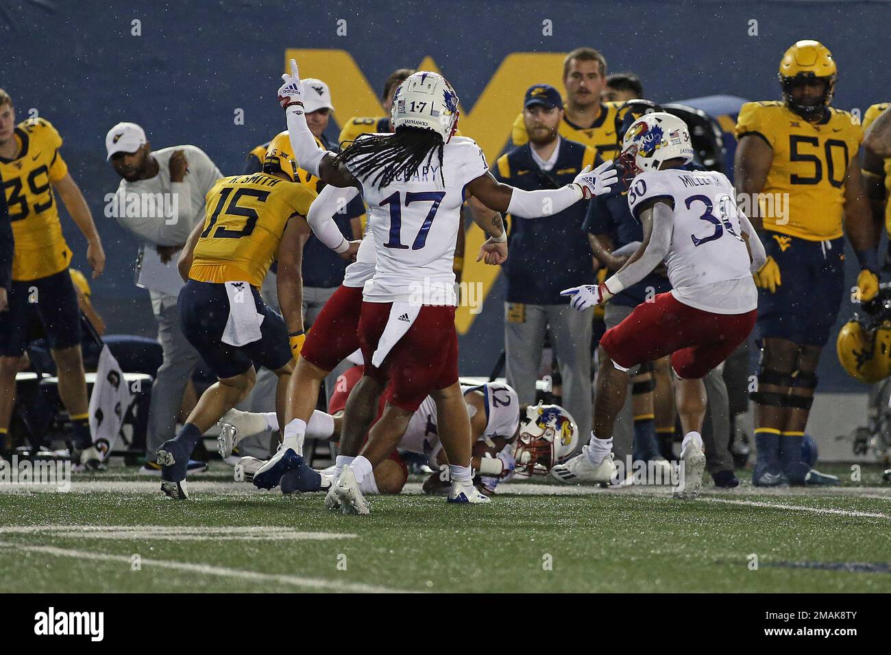Kansas running back Torry Locklin (12) recovers a fumble by West ...