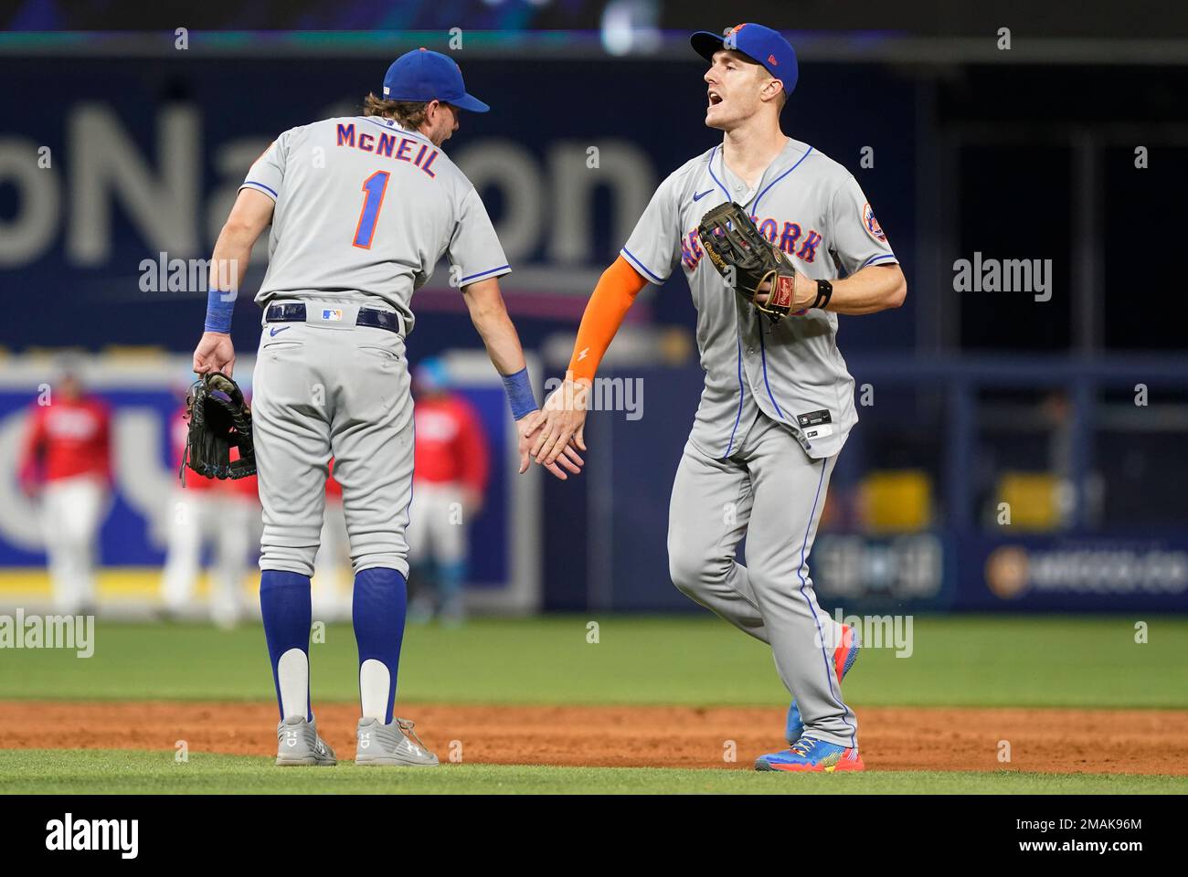 New York Mets' Mark Canha and Jeff McNeil (1) congratulate each other ...