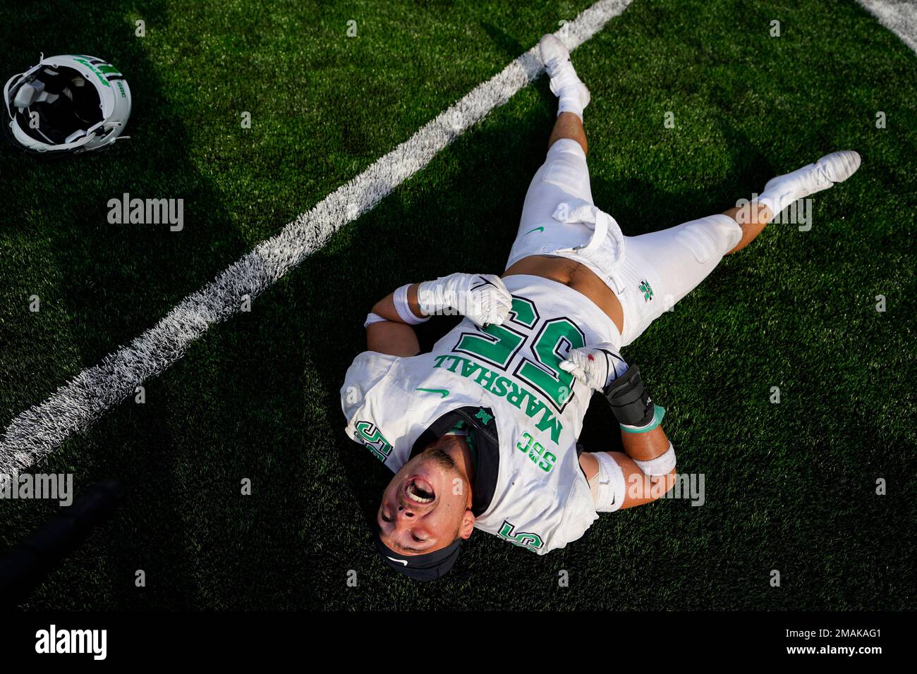 Marshall defensive lineman Owen Porter (55) celebrates after the team's ...