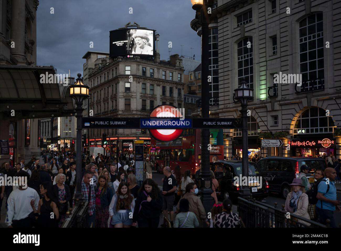 A giant screen atop a building displays a photo honouring Queen ...
