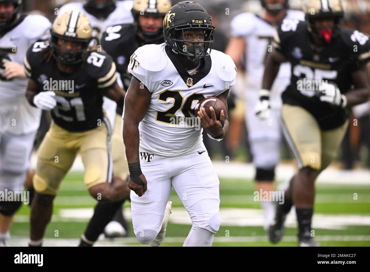 Wake Forest running back Quinton Cooley (28) breaks away from ...