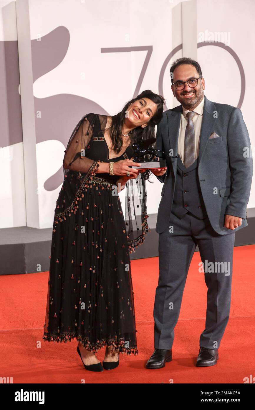 Reza Heydari, right, and Mina Khosravani, pose with the Special Jury Prize they accepted on ...