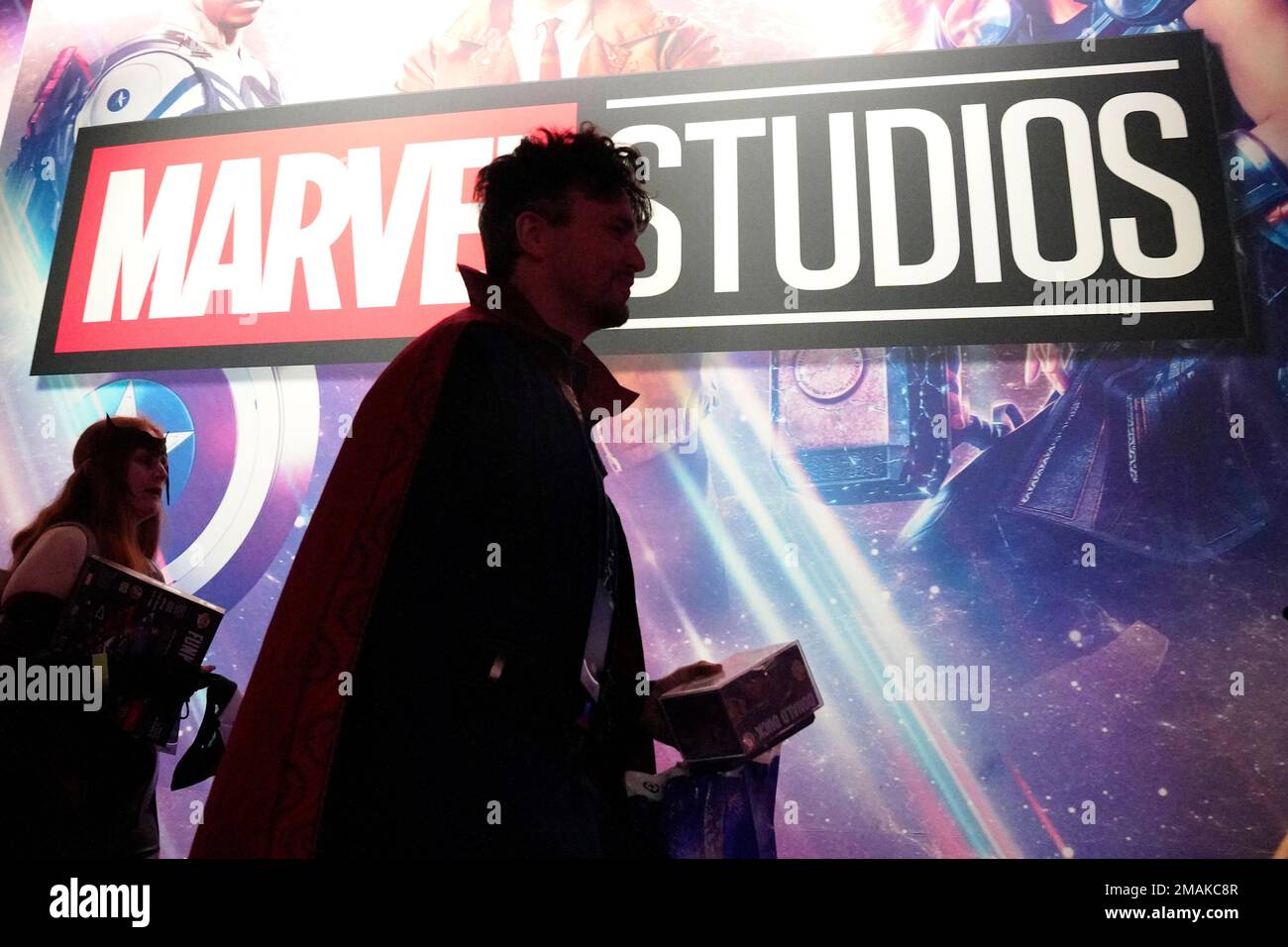 A cosplayer dressed as Doctor Strange passes by a Marvel Studios ...