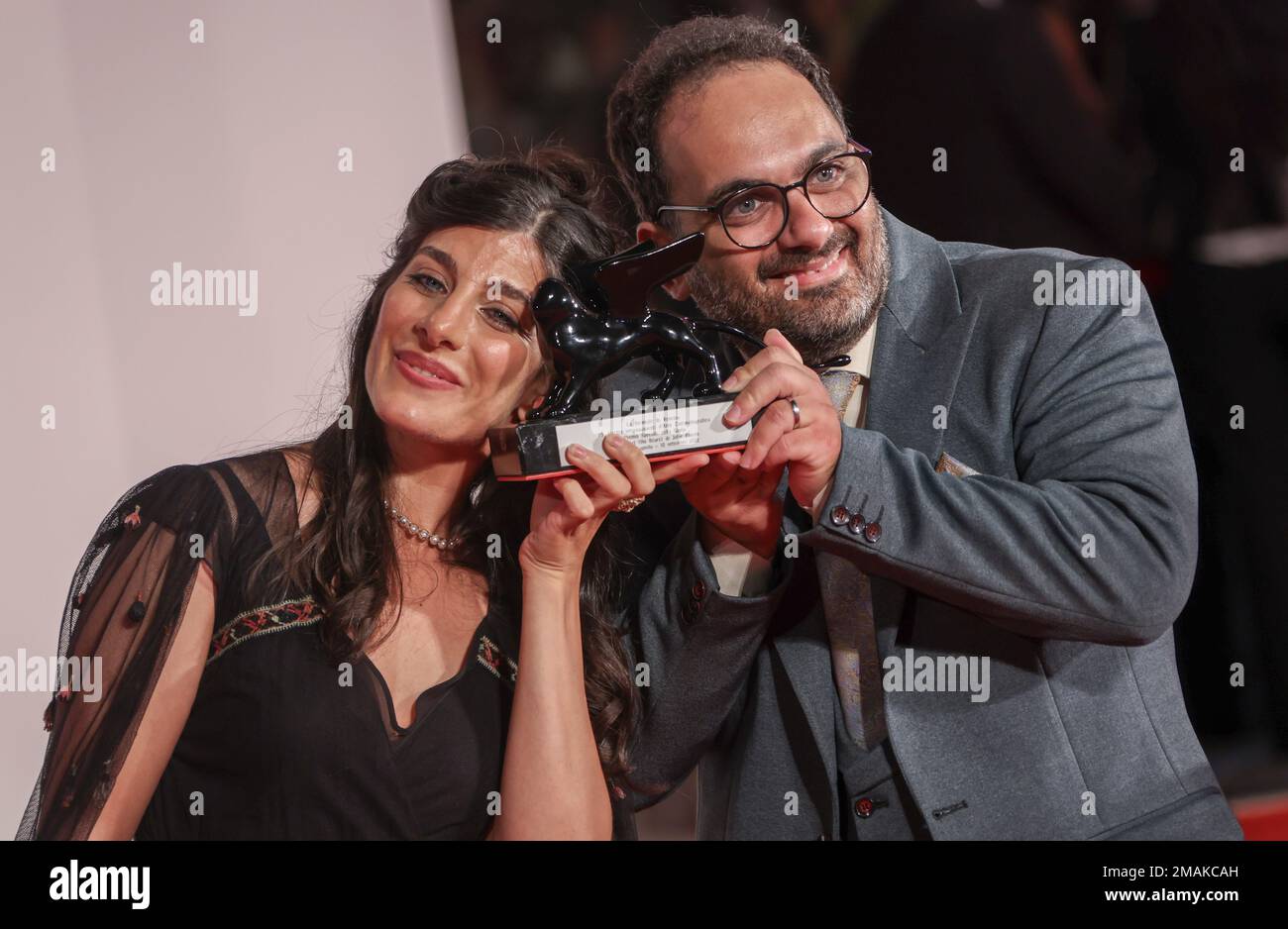 Reza Heydari, right, and Mina Khosravani, pose with the Special Jury Prize they accepted on ...