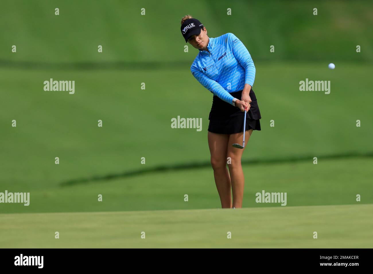 Gaby Lopez, of Mexico, chips onto the fourth green during the third ...