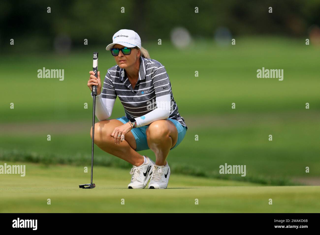 Sarah Kemp, of Australia, lines up a putt on the fourth green during ...