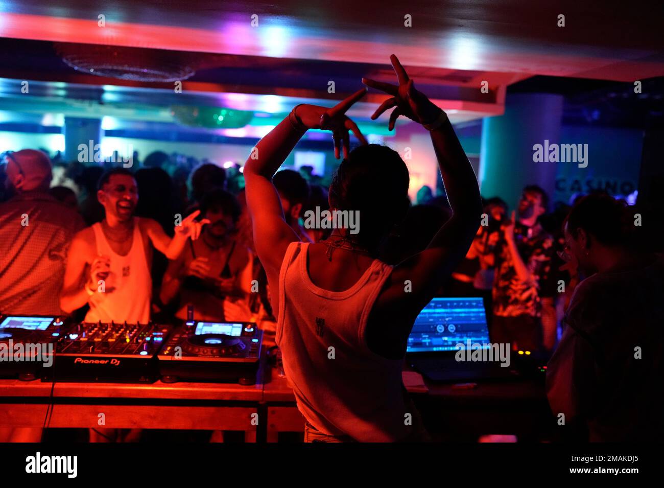 People dance at a DJ party in Caracas, Venezuela, early Saturday, Sept ...