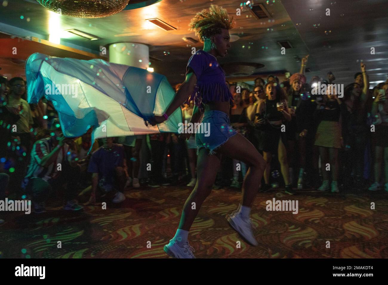 People dance at a party in Caracas, Venezuela, late Friday, Sept. 9 ...