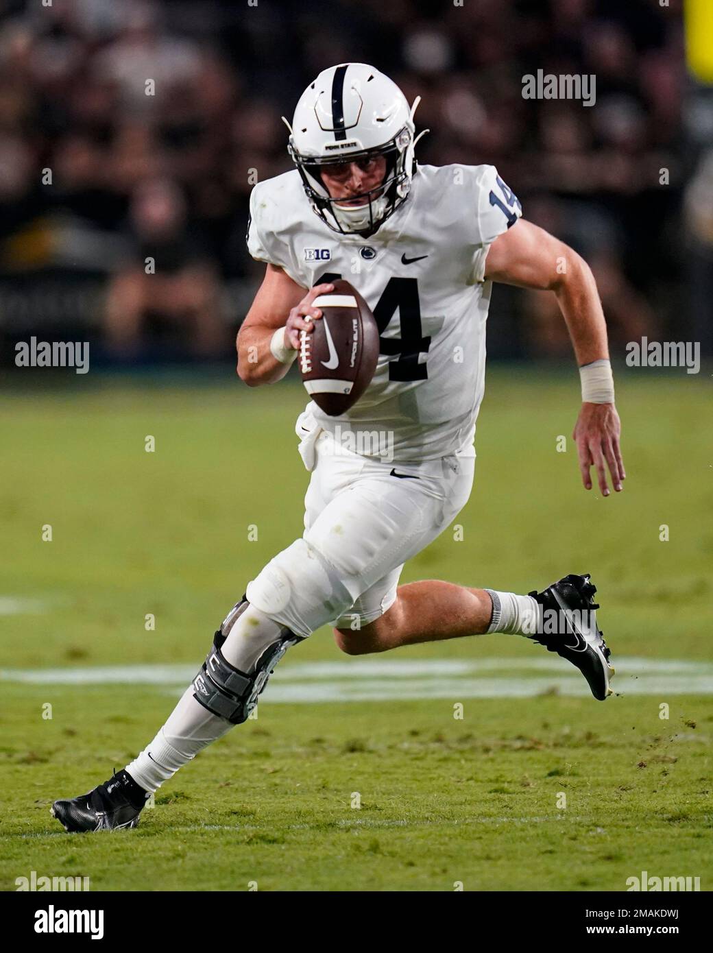 Penn State quarterback Sean Clifford (14) scrambles against Purdue ...