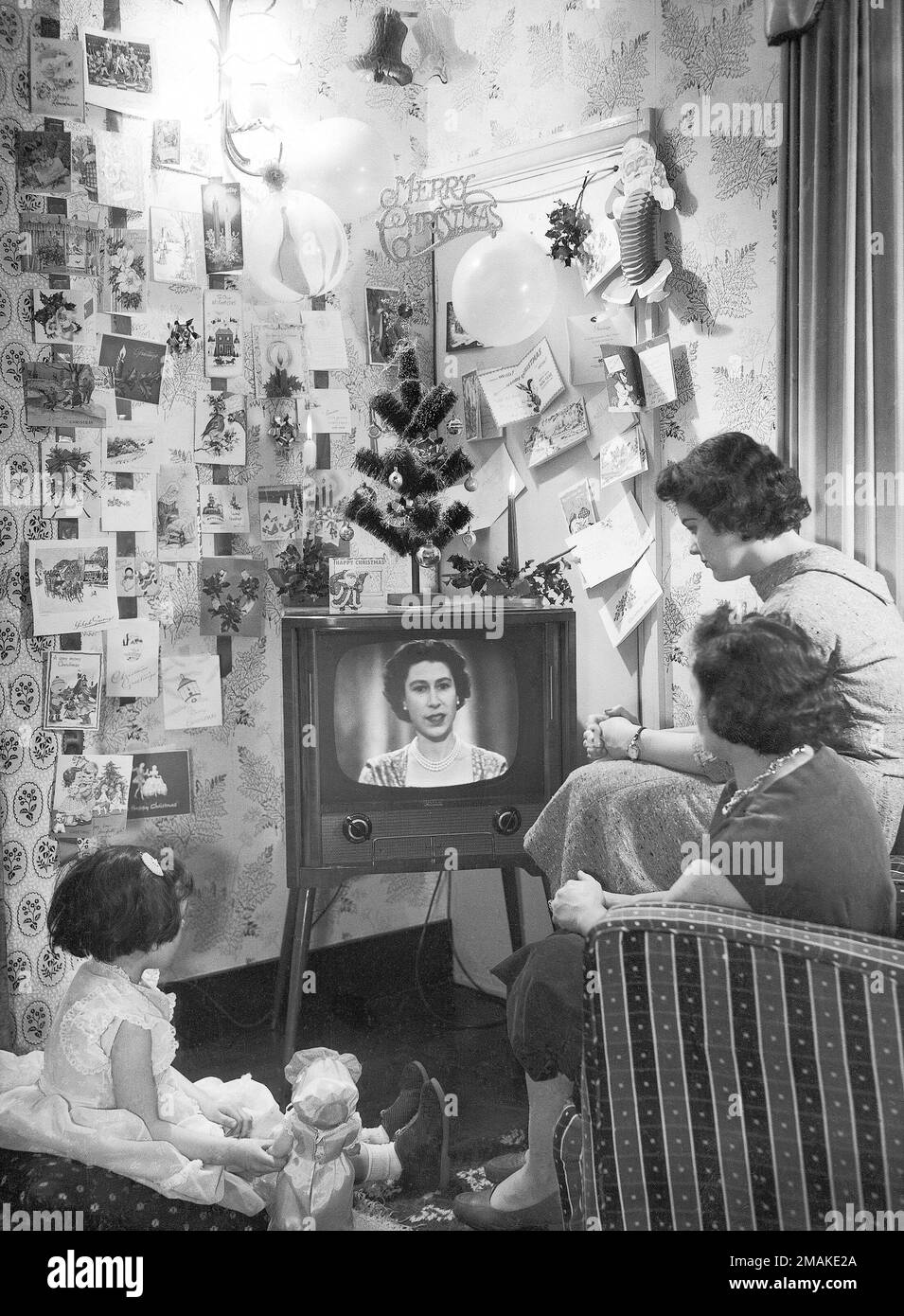 A family watch as Britain's Queen Elizabeth II makes her first ...